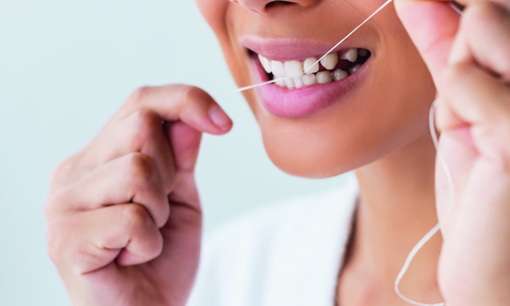 How to remove food stuck between your teeth or gums - Royal Examiner